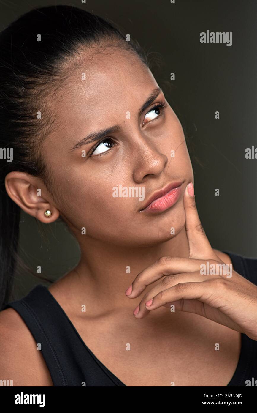 Latina Girl Thinking Stock Photo - Alamy