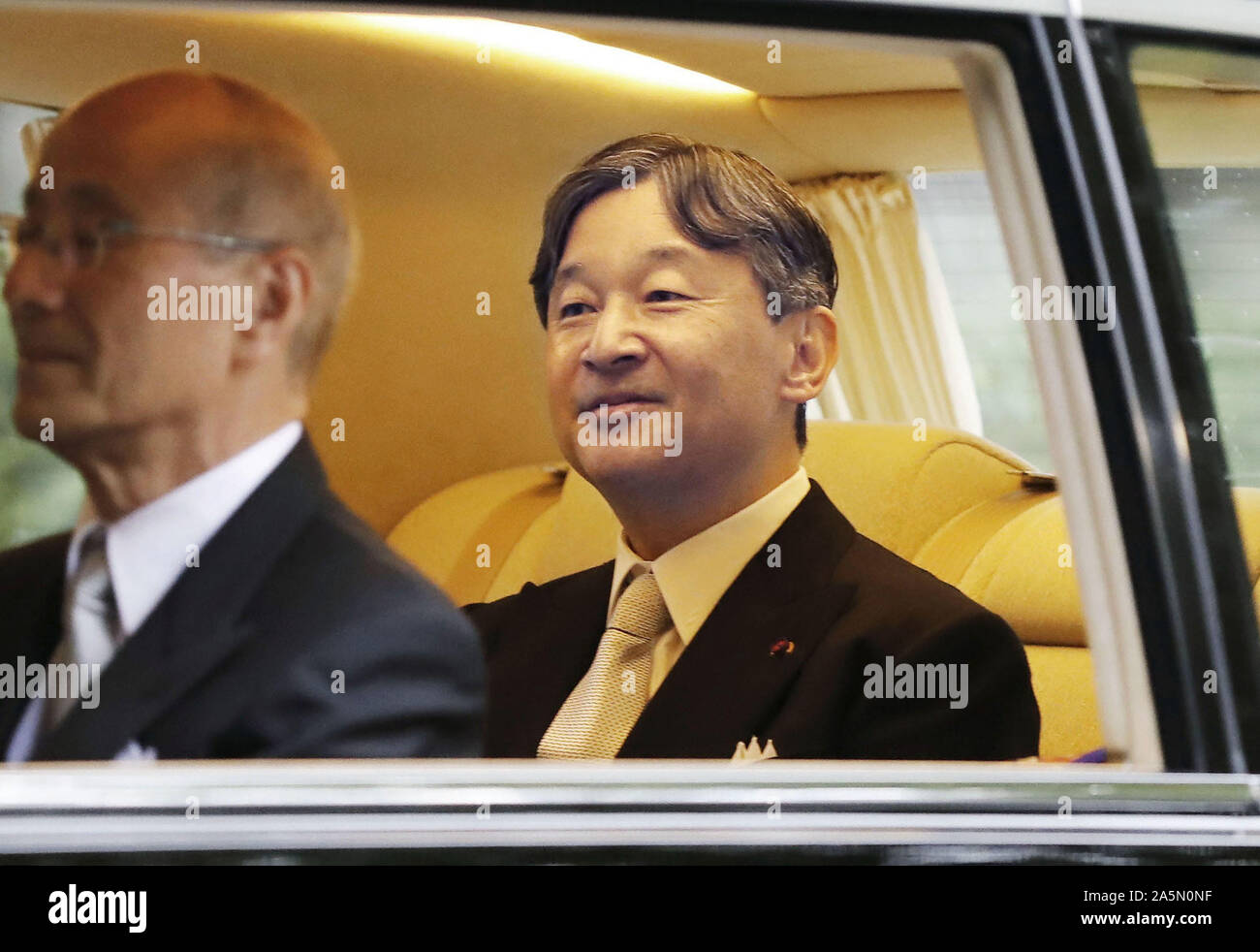 Tokyo, Japan. 22nd Oct, 2019. Japanese Emperor Naruhito is driven to ...