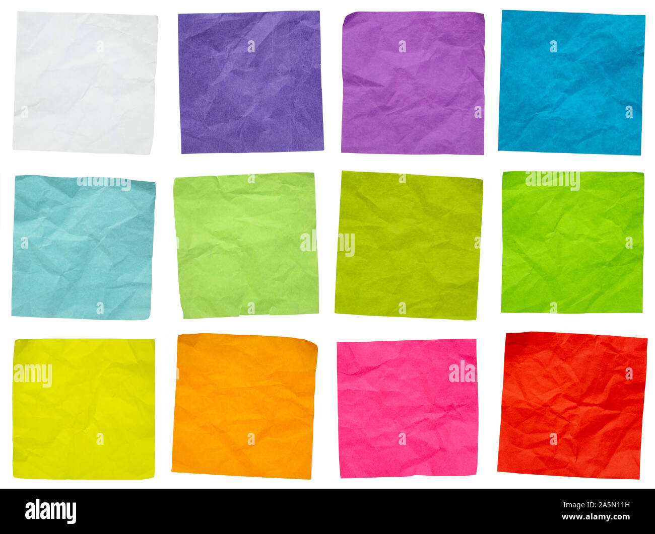 a set of colorful, crumpled sticky reminder notes isolated on white ...