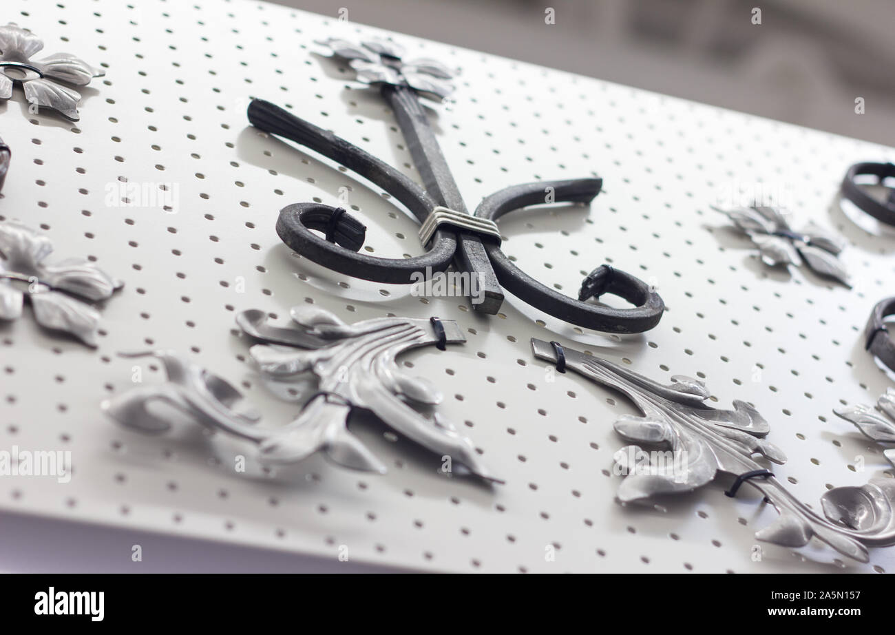 Forged iron products. Beautiful wrought iron products on a stand Stock ...