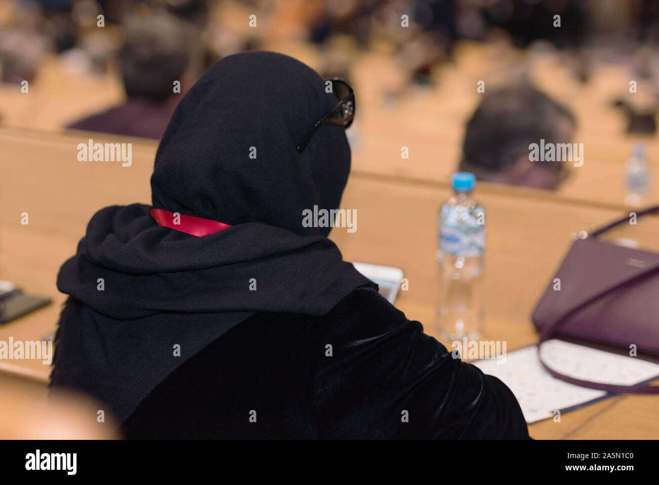 Muslim Business woman at business conference room with public giving ...
