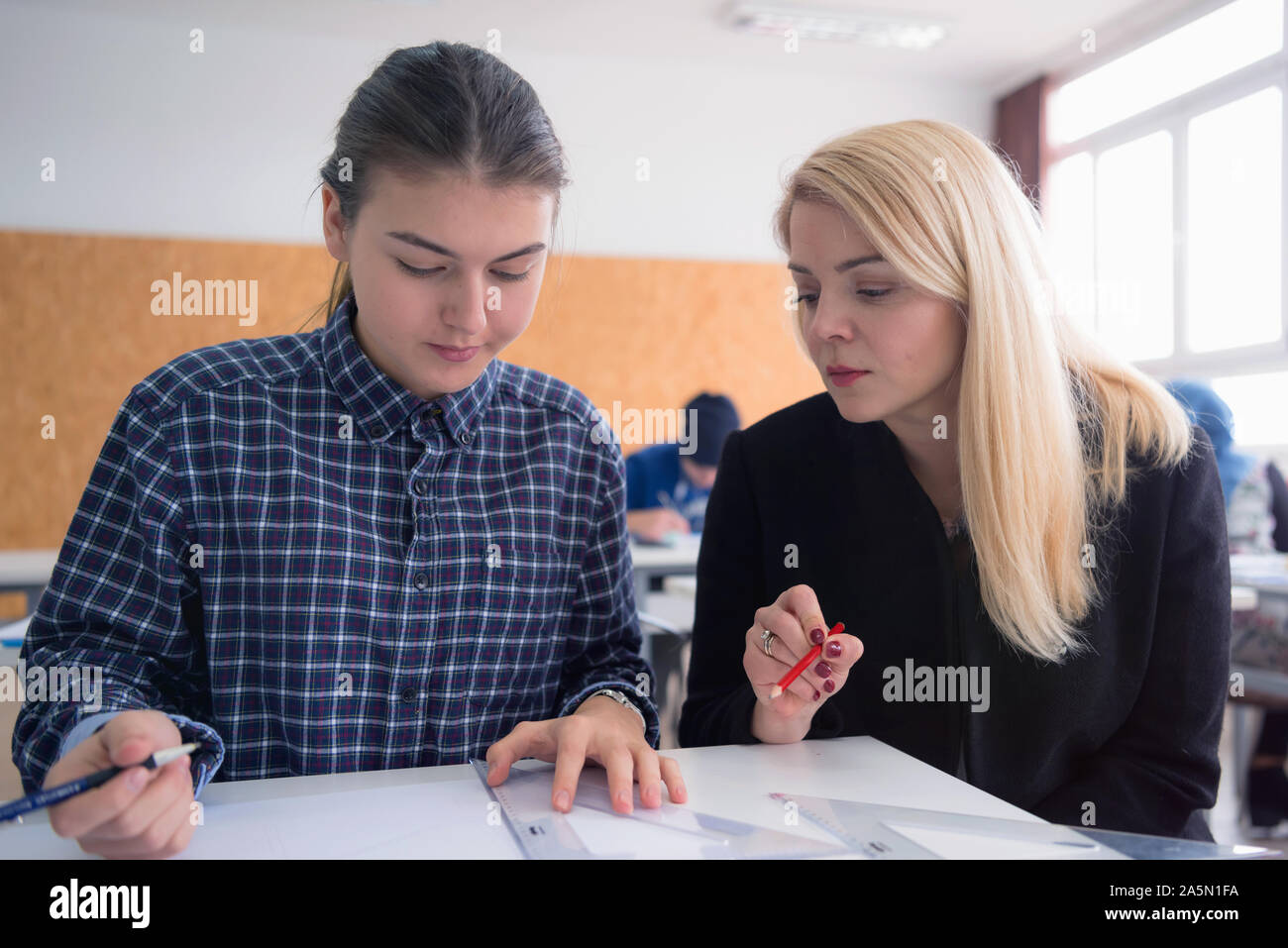 Female Architecture teacher at work. Female professor explain ...