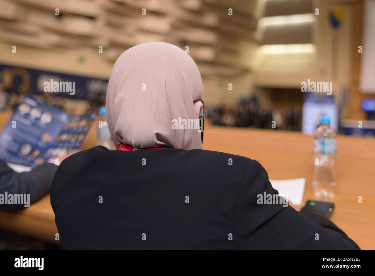 Muslim Business woman at business conference room with public giving ...