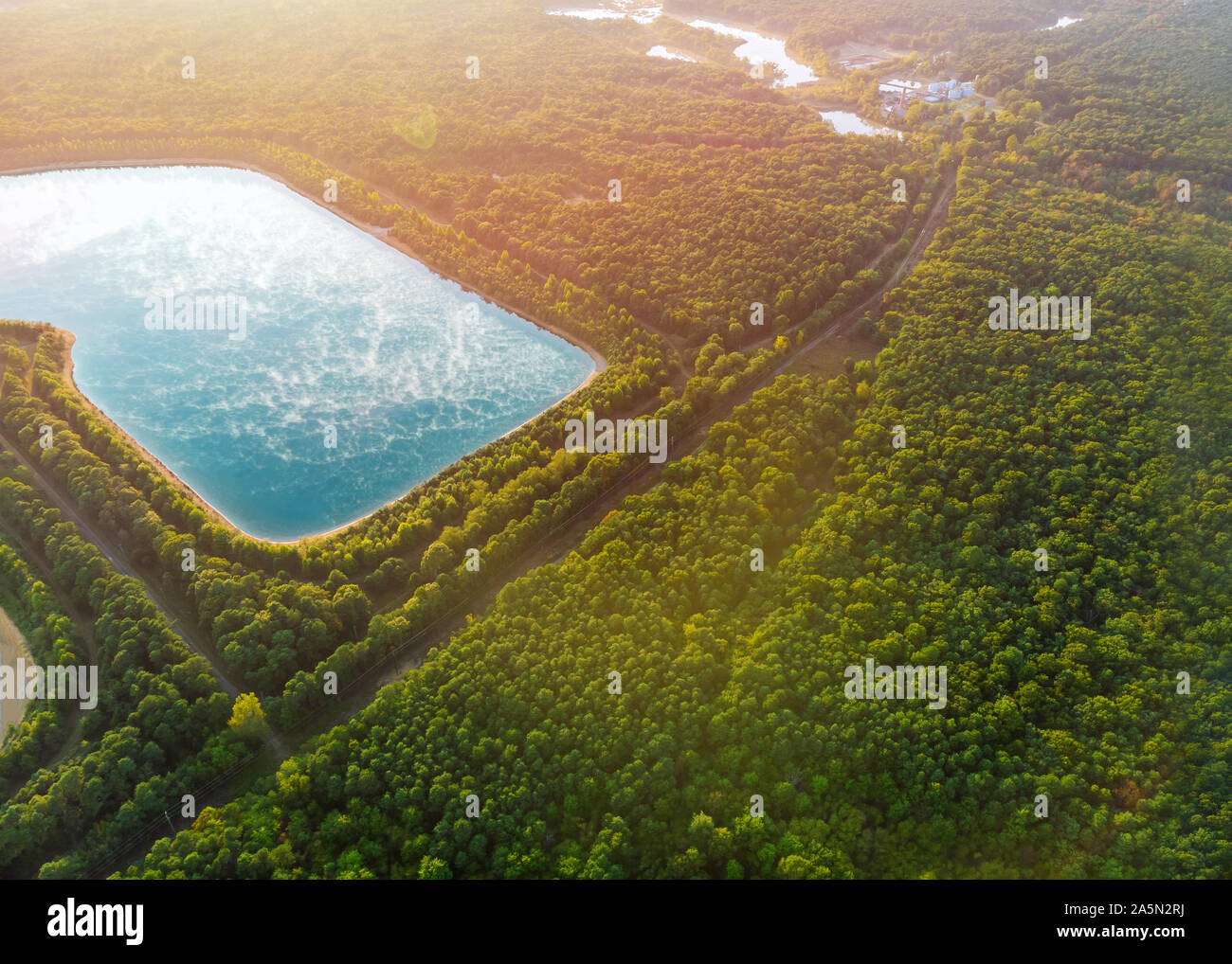 Aerial lake in flying a drone over the lake landscape and green grass ...
