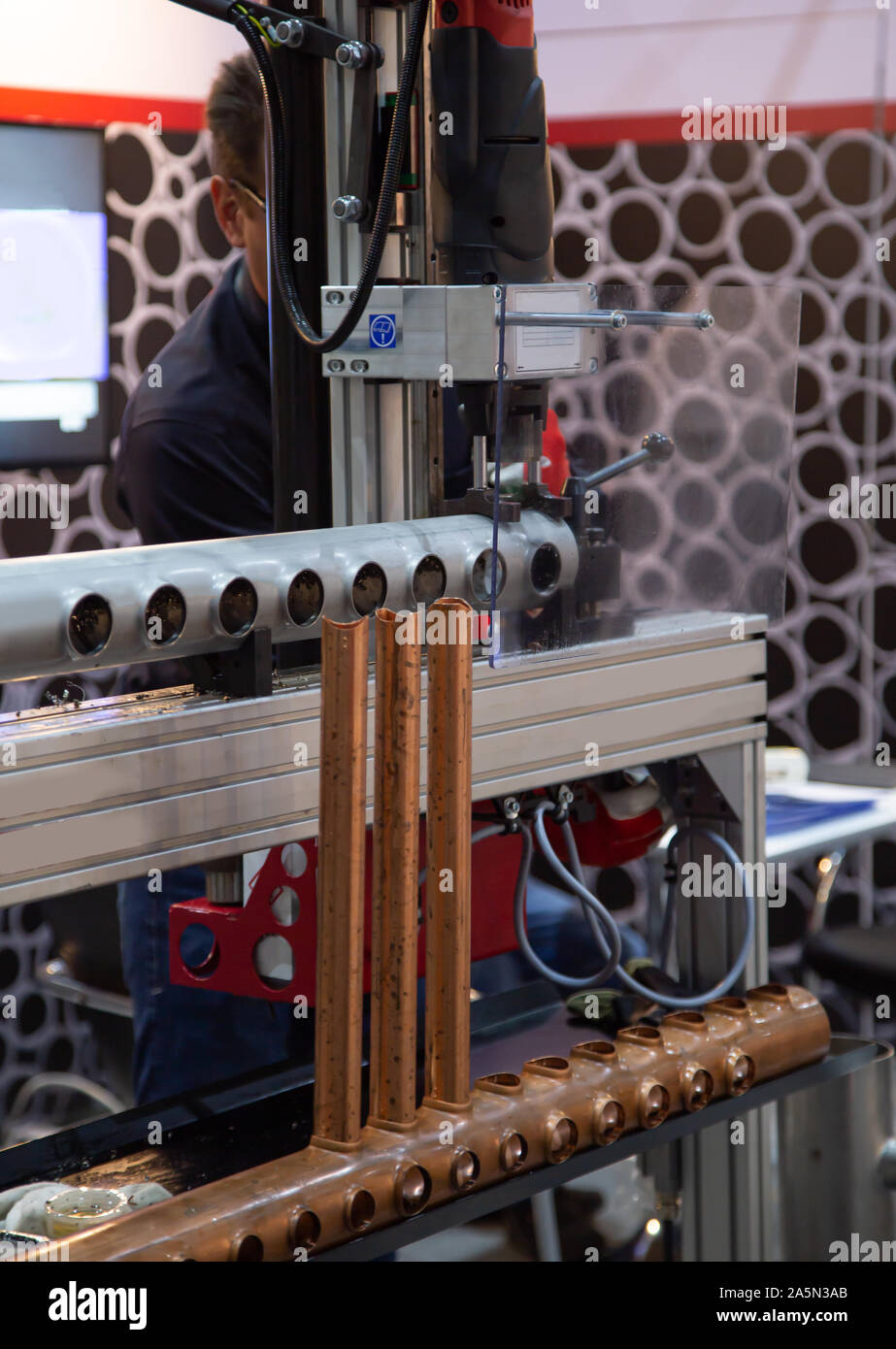 Manifold pipe fabricating and collar forming machine Stock Photo - Alamy