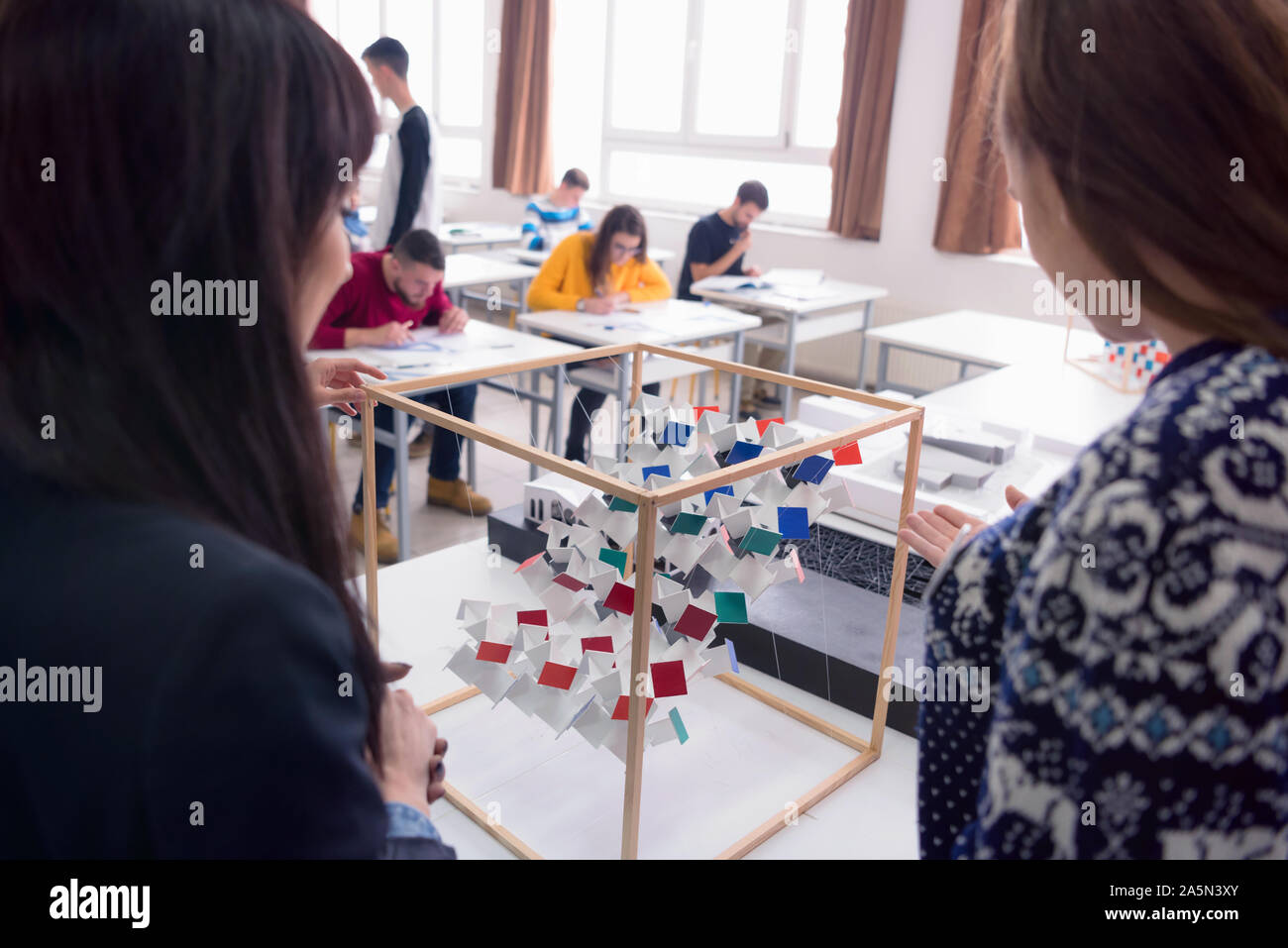 Female Architecture teacher at work. Female professor explain ...