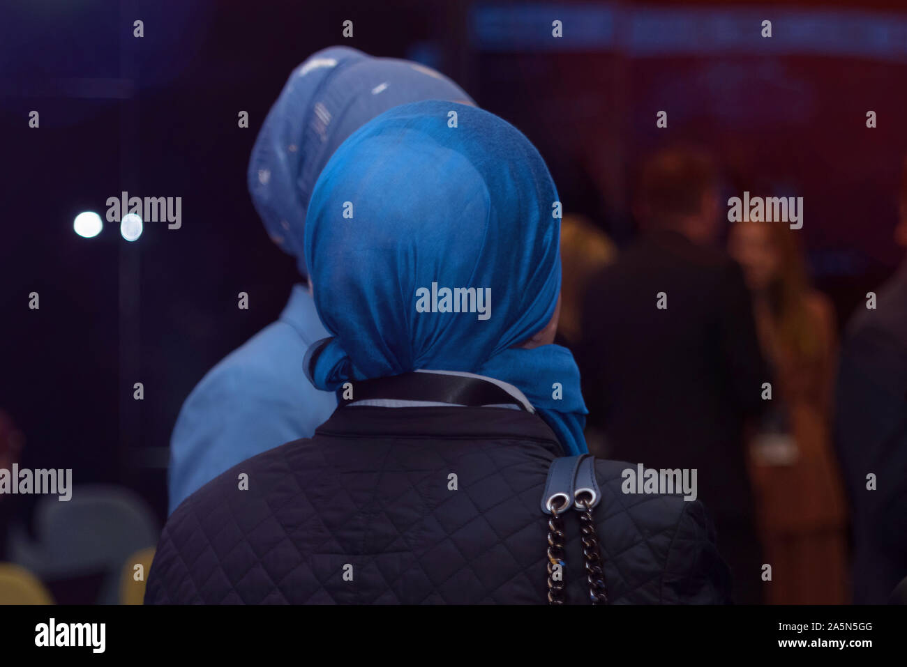 Business muslim woman as leader speaking at Conference. Audience at the ...