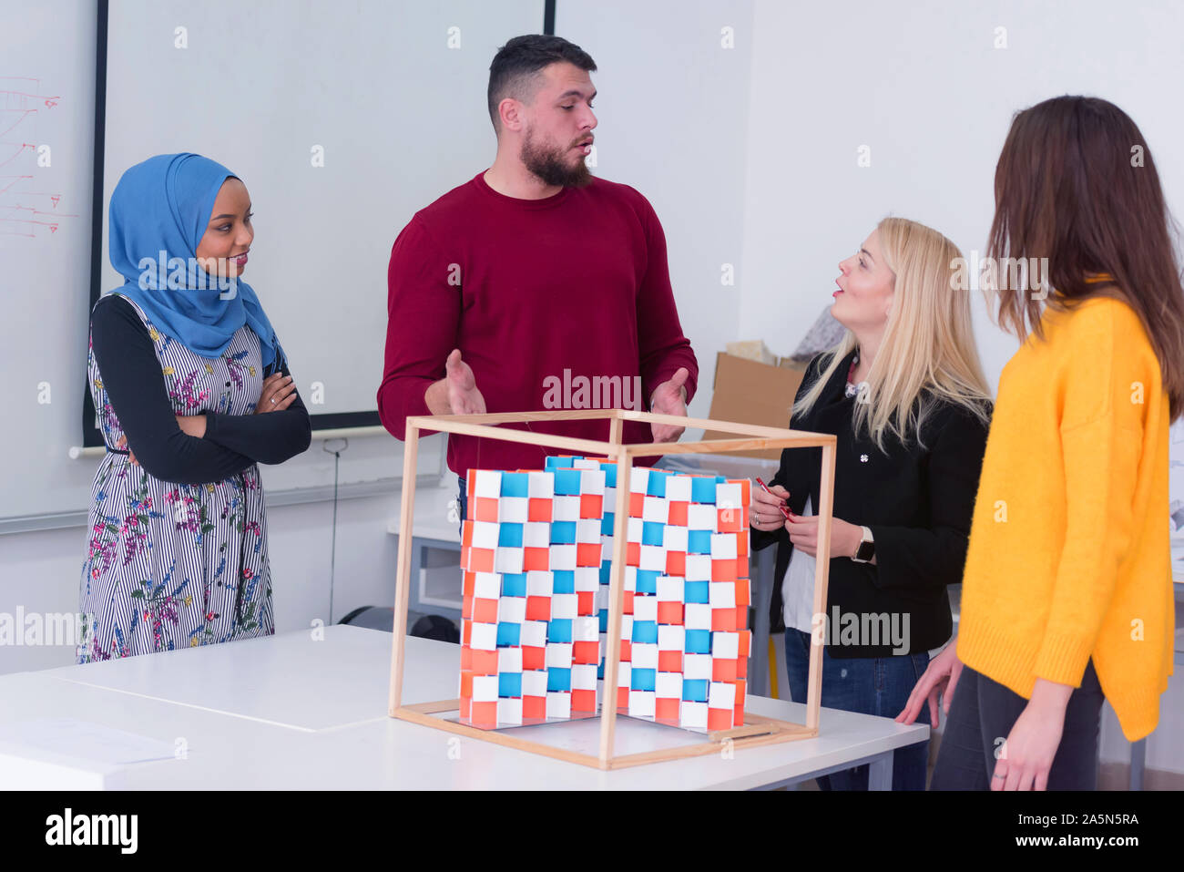 Female Architecture teacher at work. Female professor explain ...