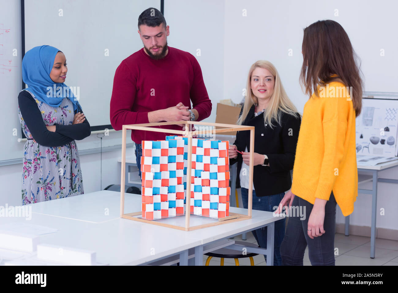 Female Architecture teacher at work. Female professor explain ...