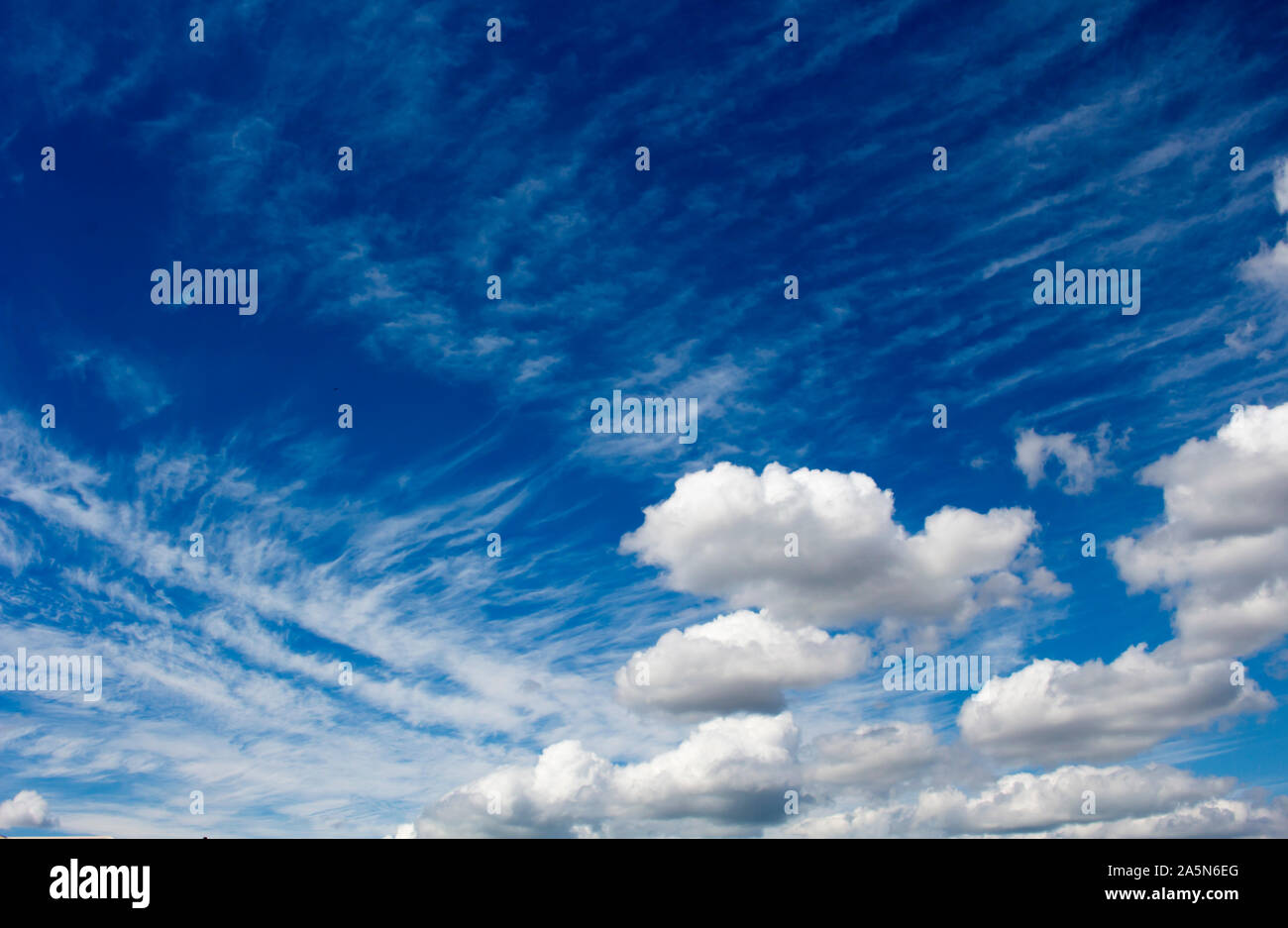 Fluffy white cumulus cumulostratus cloud formations on a spring ...