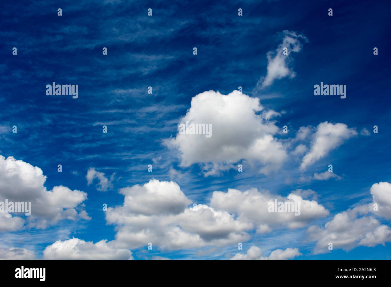Fluffy white cumulus cumulostratus cloud formations on a spring ...