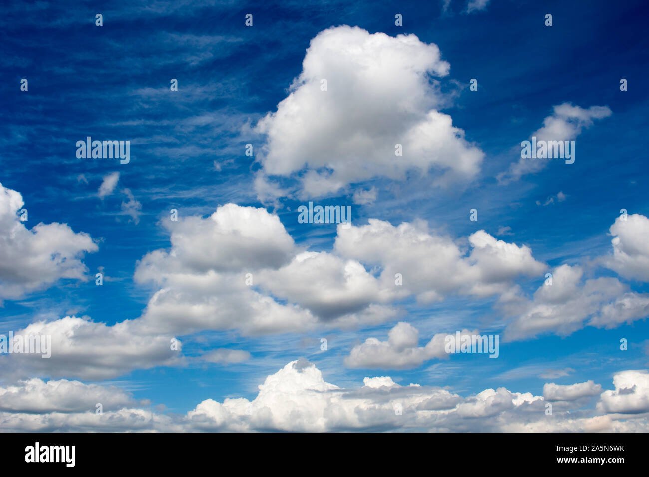 Fluffy white cumulus cumulostratus cloud formations on a spring ...