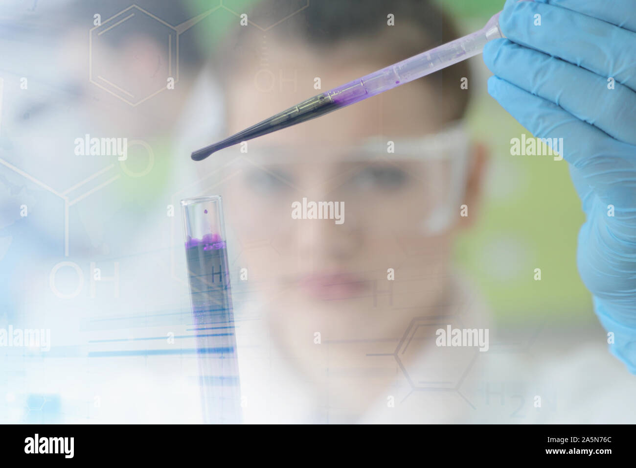 Two Young Female and male Laboratory scientists working at lab with ...