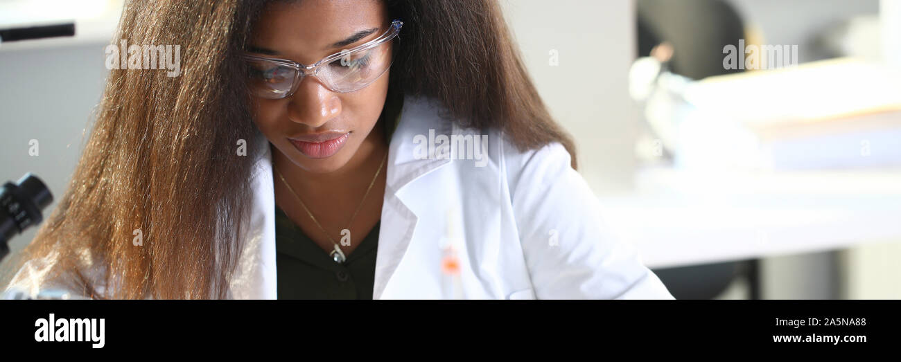 Black female chemist student conducting research Stock Photo - Alamy
