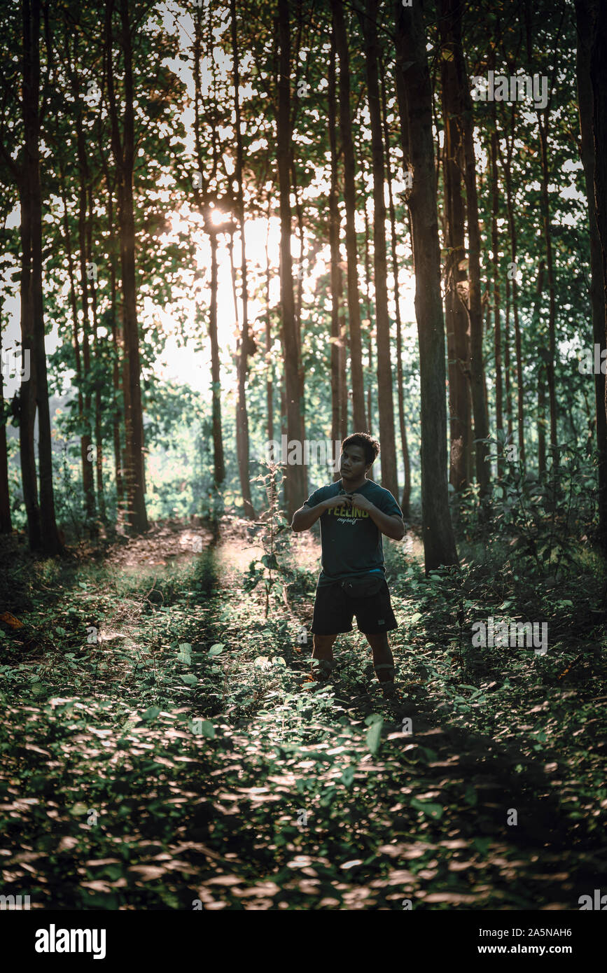 In dense dark forest man hi-res stock photography and images - Alamy