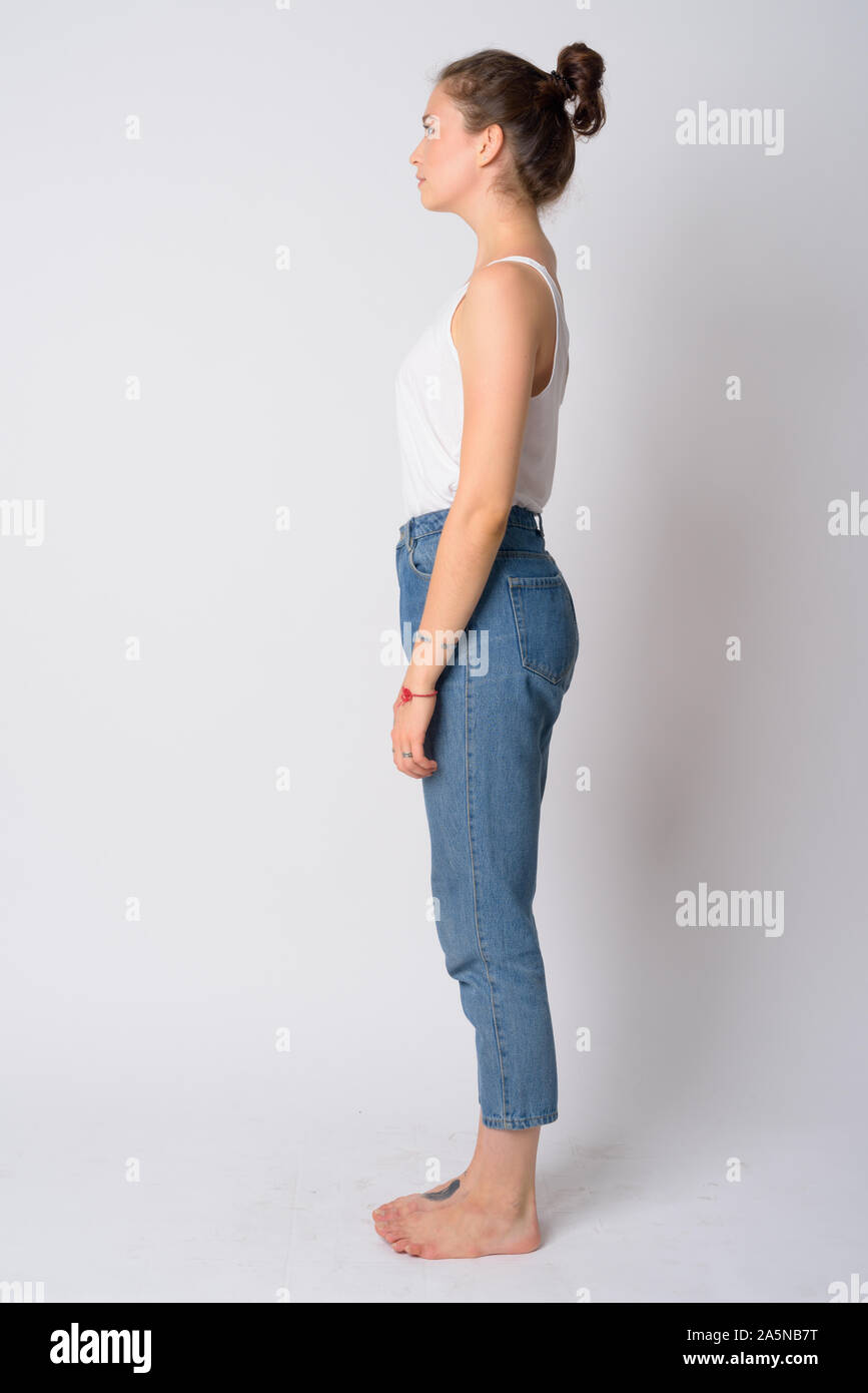 Full body shot profile view of young beautiful woman Stock Photo - Alamy