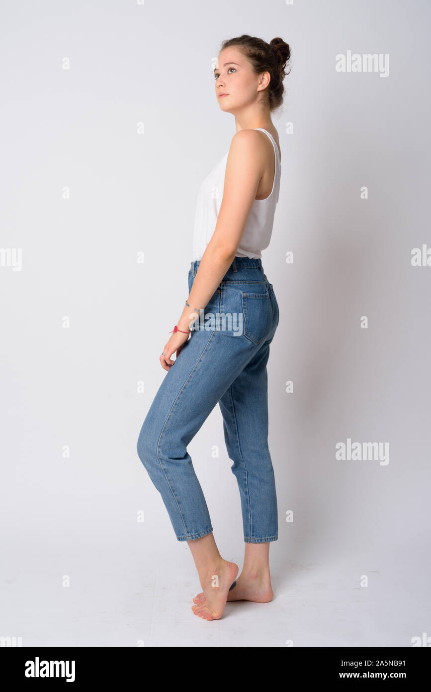 Full body shot profile view of young beautiful woman looking up Stock ...