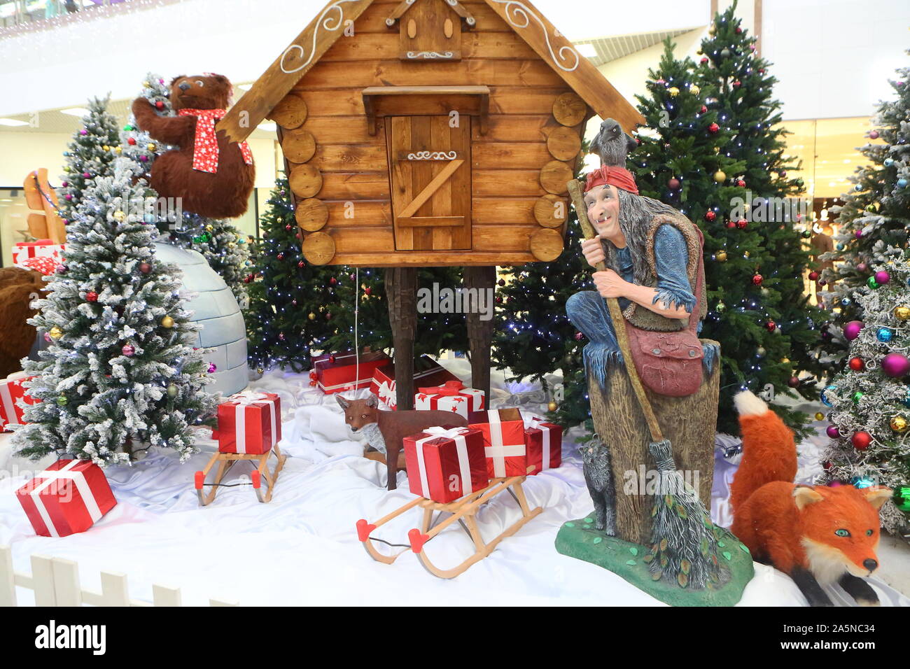 New Year's interior with the hut of Baba Yaga, Christmas trees, and a ...
