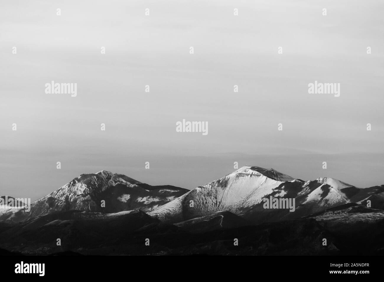 View snow covered mountain high Black and White Stock Photos & Images ...