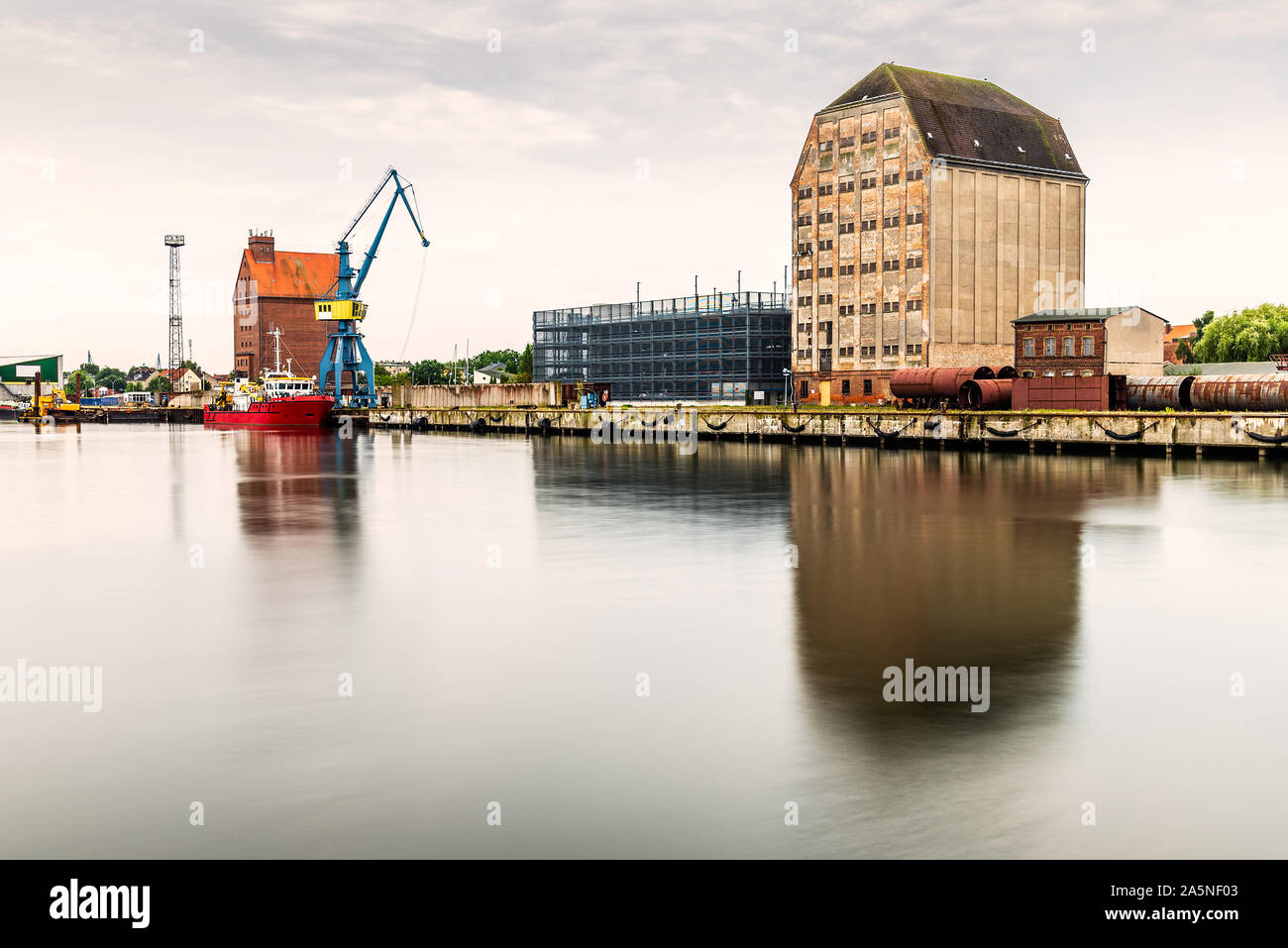 Panoramic view of the commercial harbour of Stralsund with cranes ...