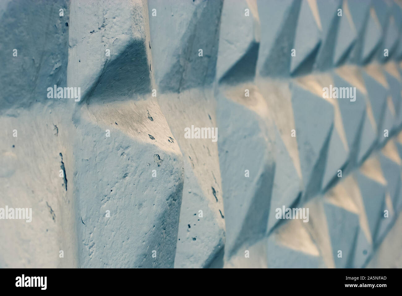 Abstract grunge background. Concrete faceted geometric figures of a ...