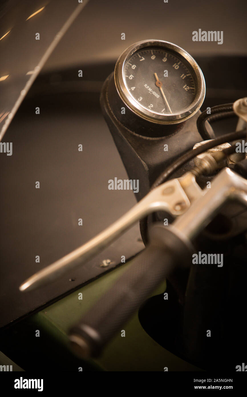 Close up vertical image of the tachometer gauge of a vintage motorcycle ...