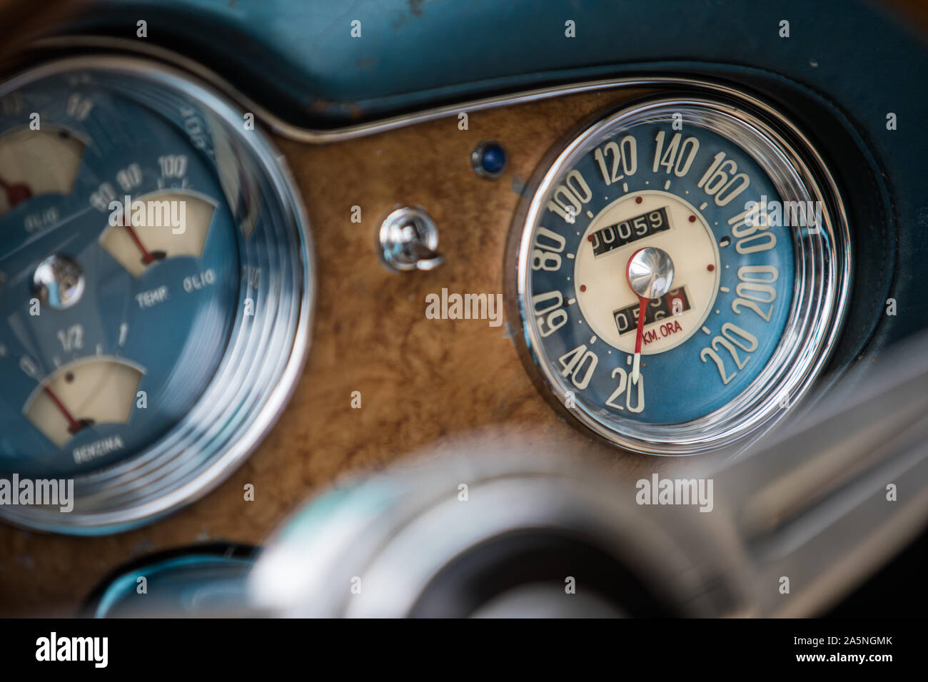 Color close up shot of a blue speedometer on a vintage car's dashboard ...