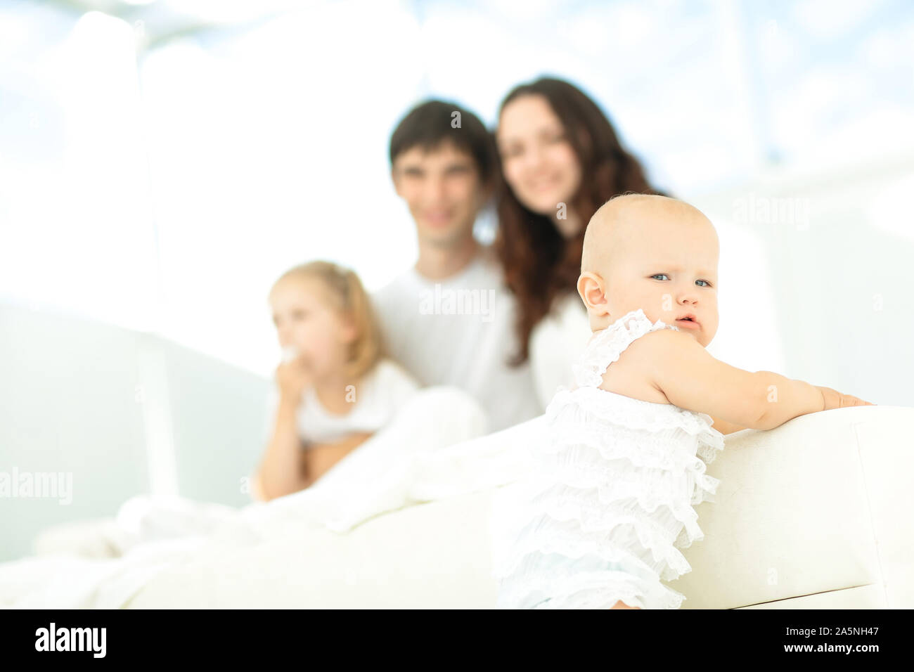 little baby on blurred background of the family.photo with copy space ...