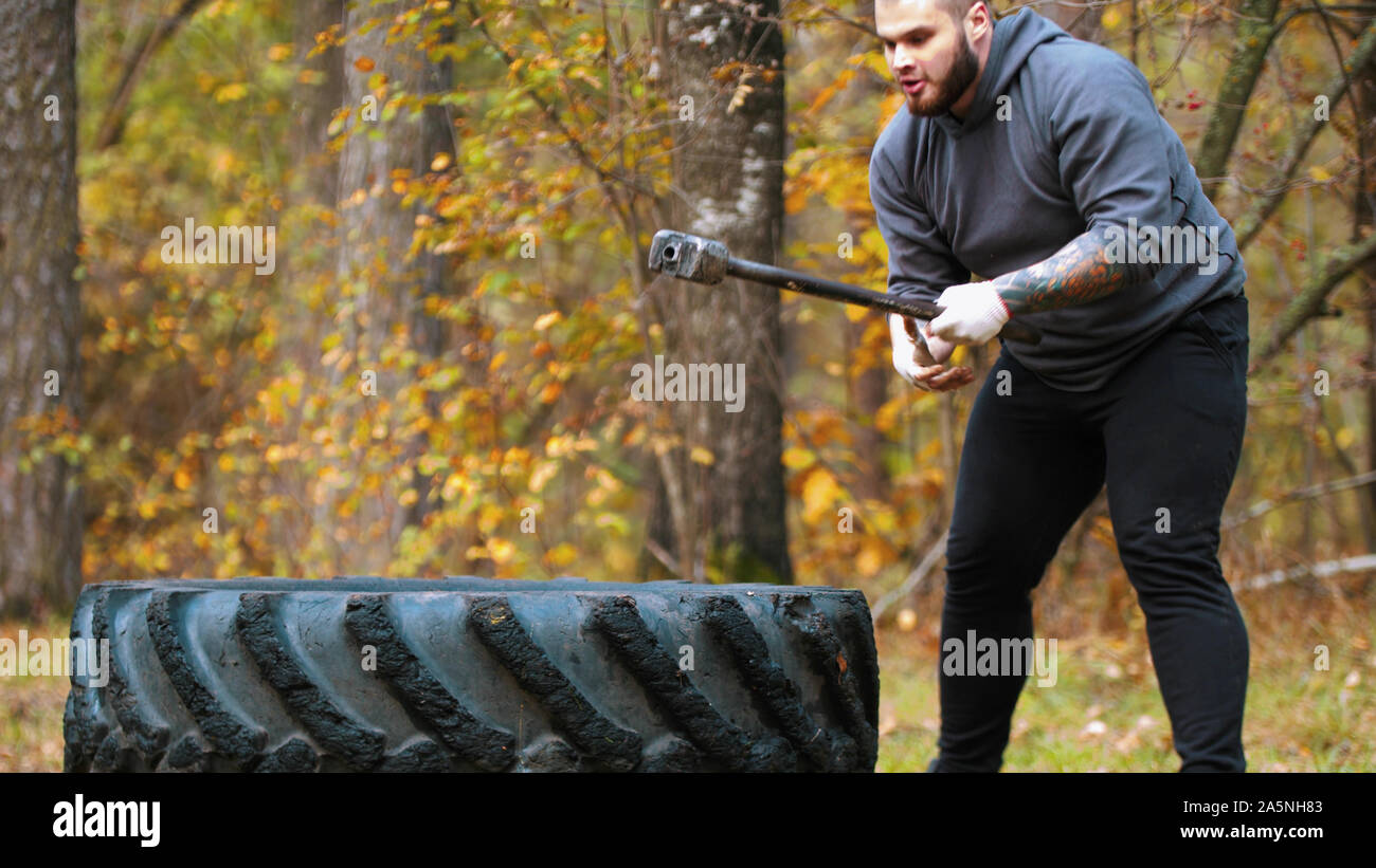 Big man bodybuilder hitting truck hi-res stock photography and images ...
