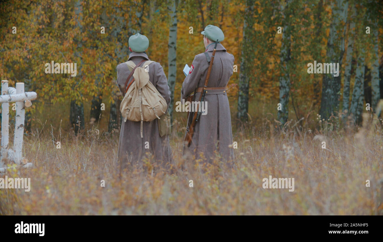 Soldiers are staying on the field and reading a map. Mid shot Stock ...