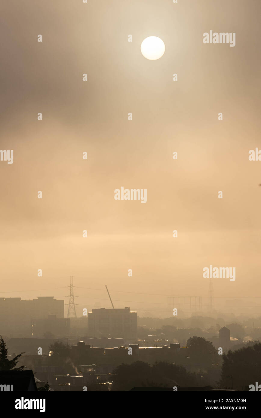London, UK - 22 October 2019. The sun rises on a misty morning over ...