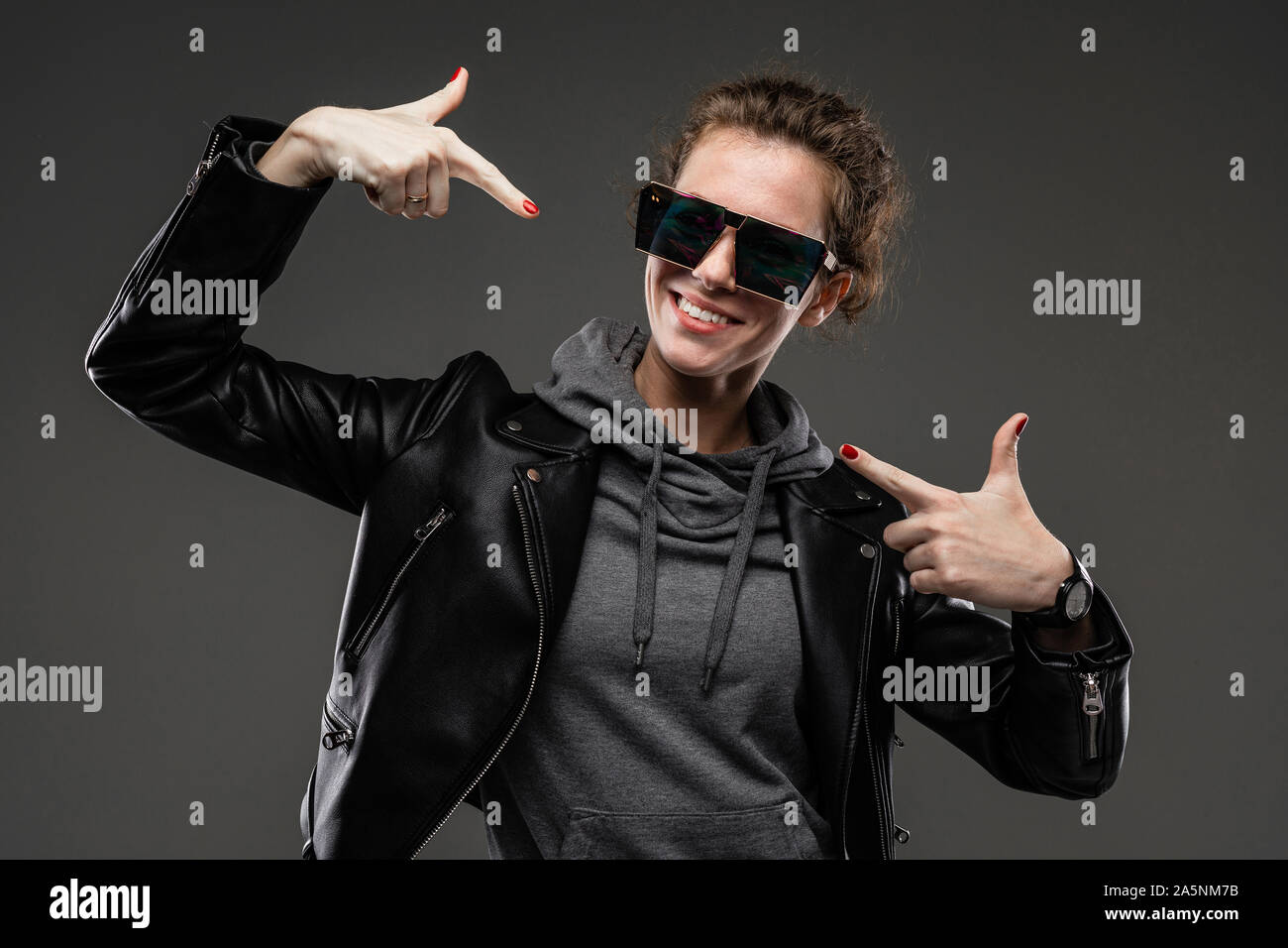 A young girl with rough facial features, patted brown hair, bright ...