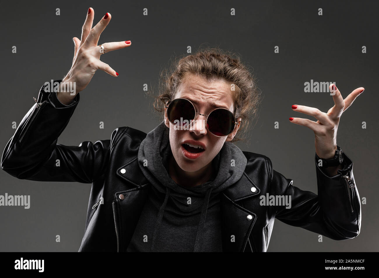 Young girl with rough facial features, patted brown hair, bright ...