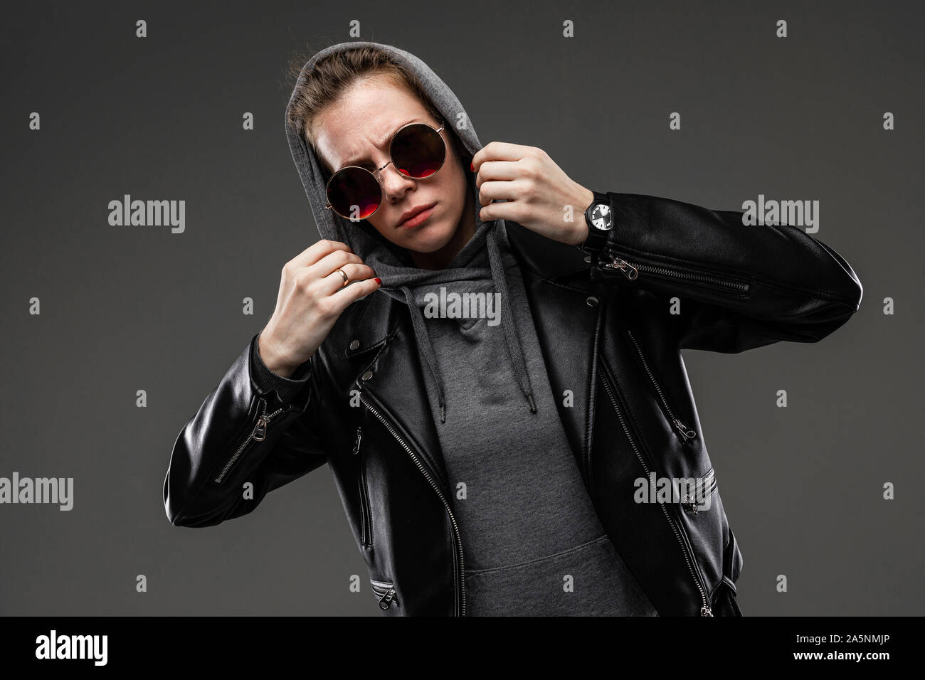 A young girl with rough facial features, patted brown hair, bright ...