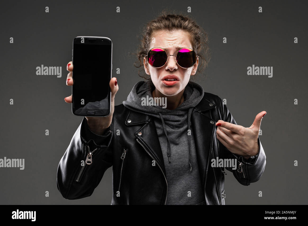 Young girl with rough facial features, patted brown hair, bright ...