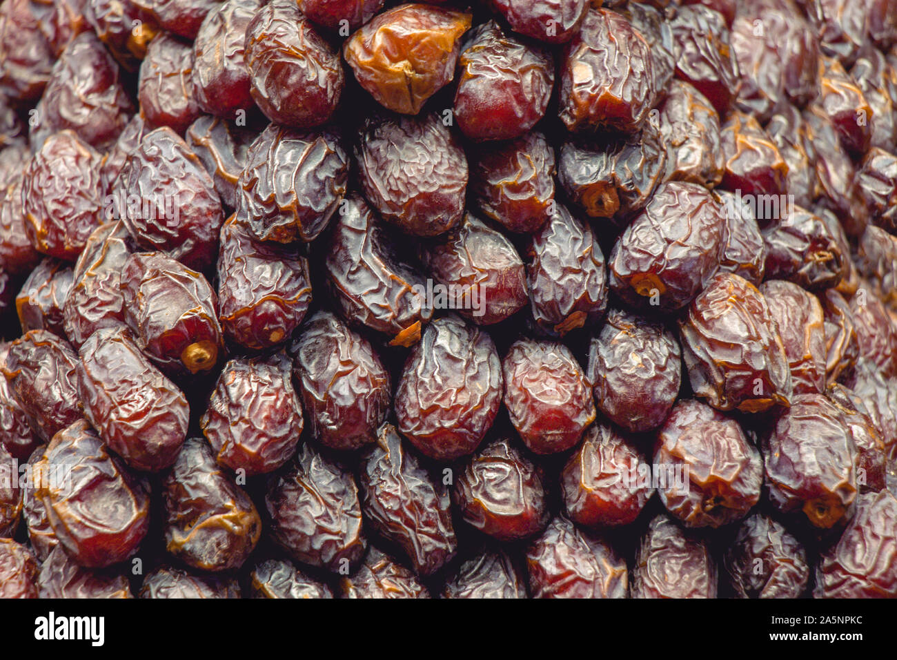 Delicious and sweet dried dates fruit background Stock Photo - Alamy