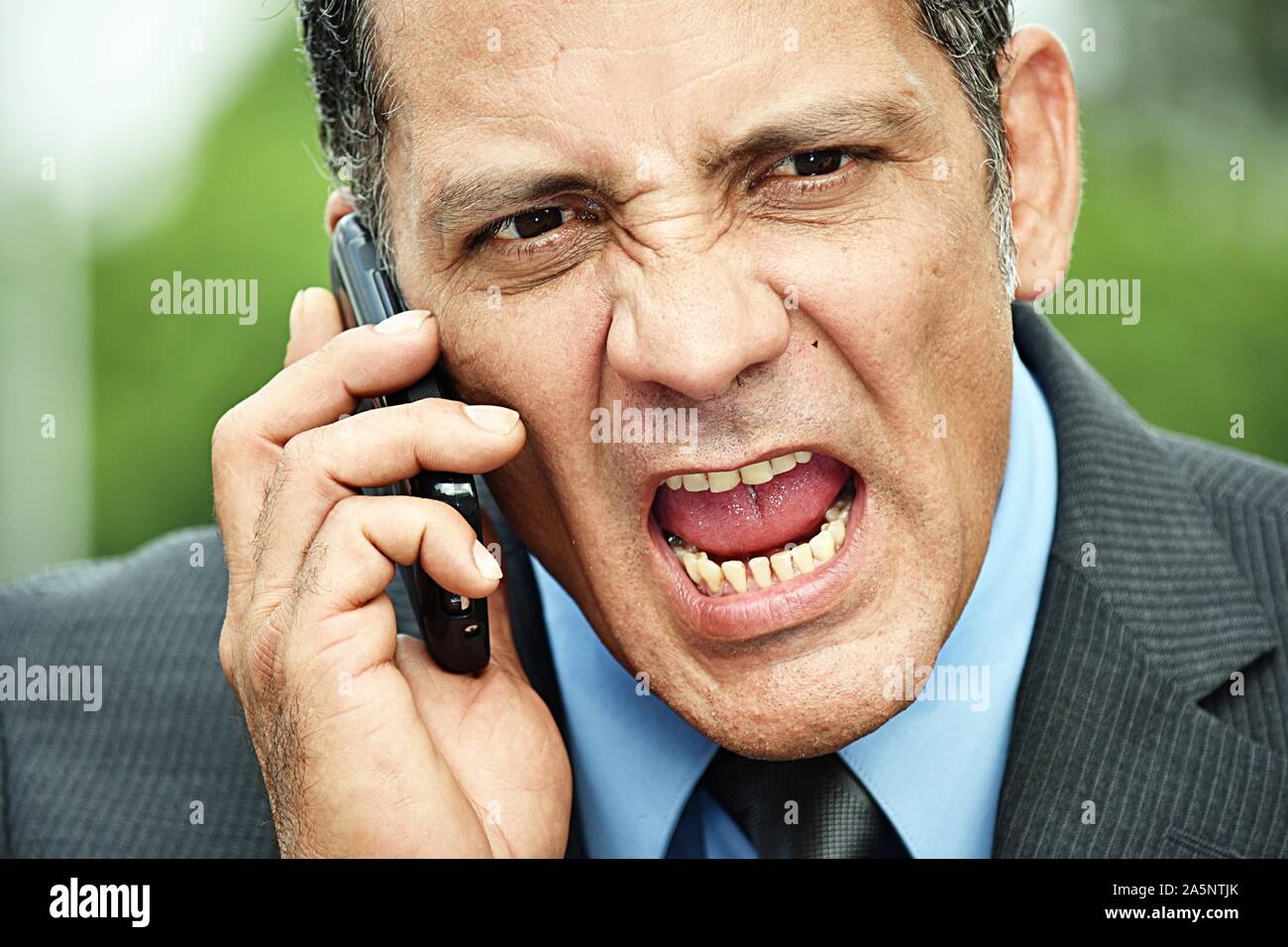 Business Man Using Cell Phone And Unhappy Stock Photo - Alamy
