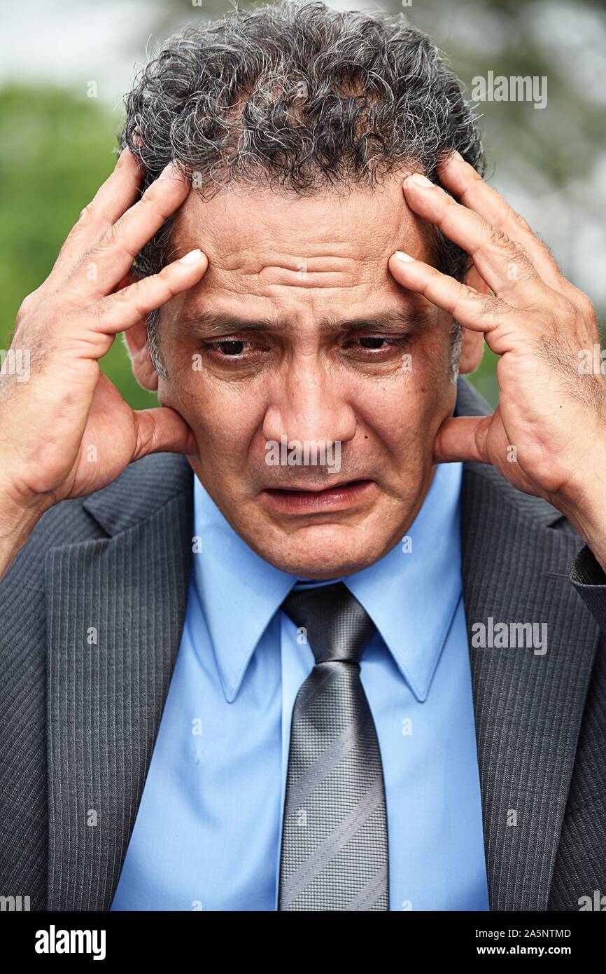 Hispanic Business Executive Under Stress Stock Photo - Alamy