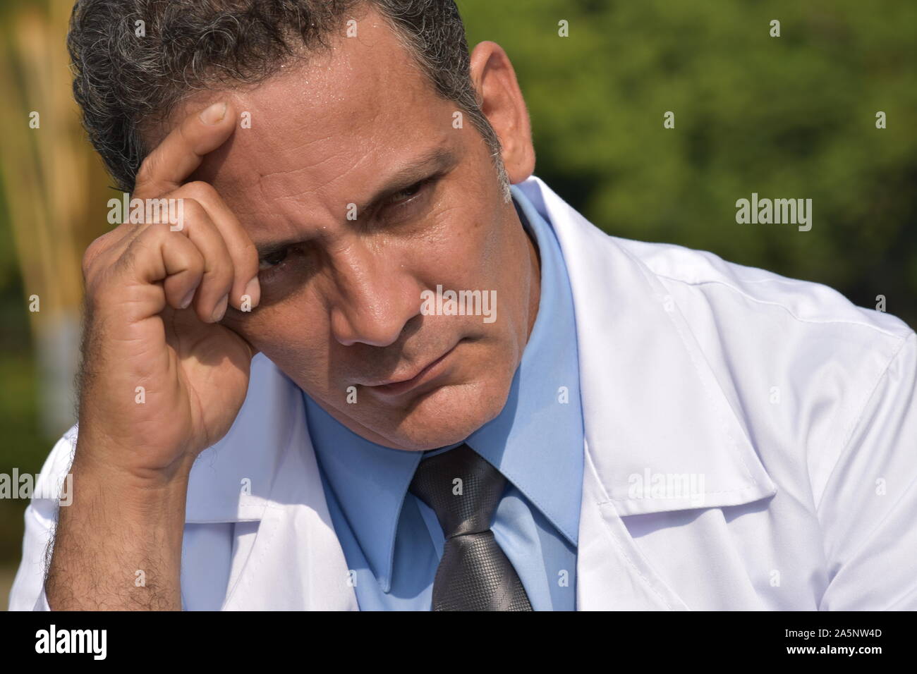 Thinking Male Doctor Stock Photo - Alamy