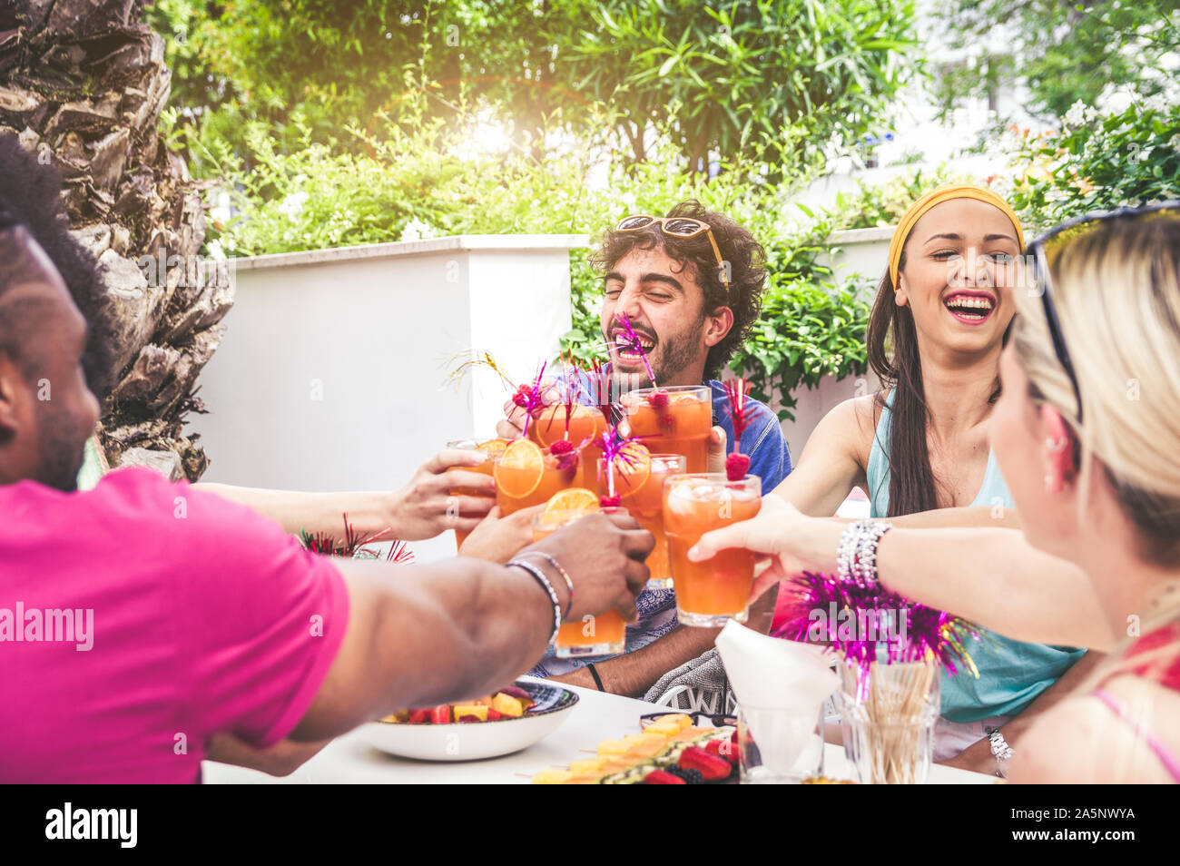 Happy friends having fun outdoor - Group of people toasting with ...
