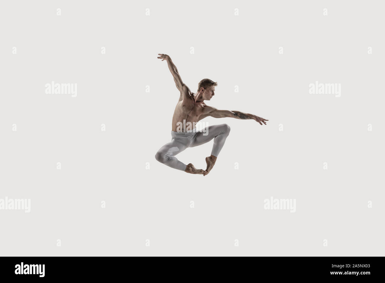 Flexible young ballet dancer stretching hi-res stock photography and ...
