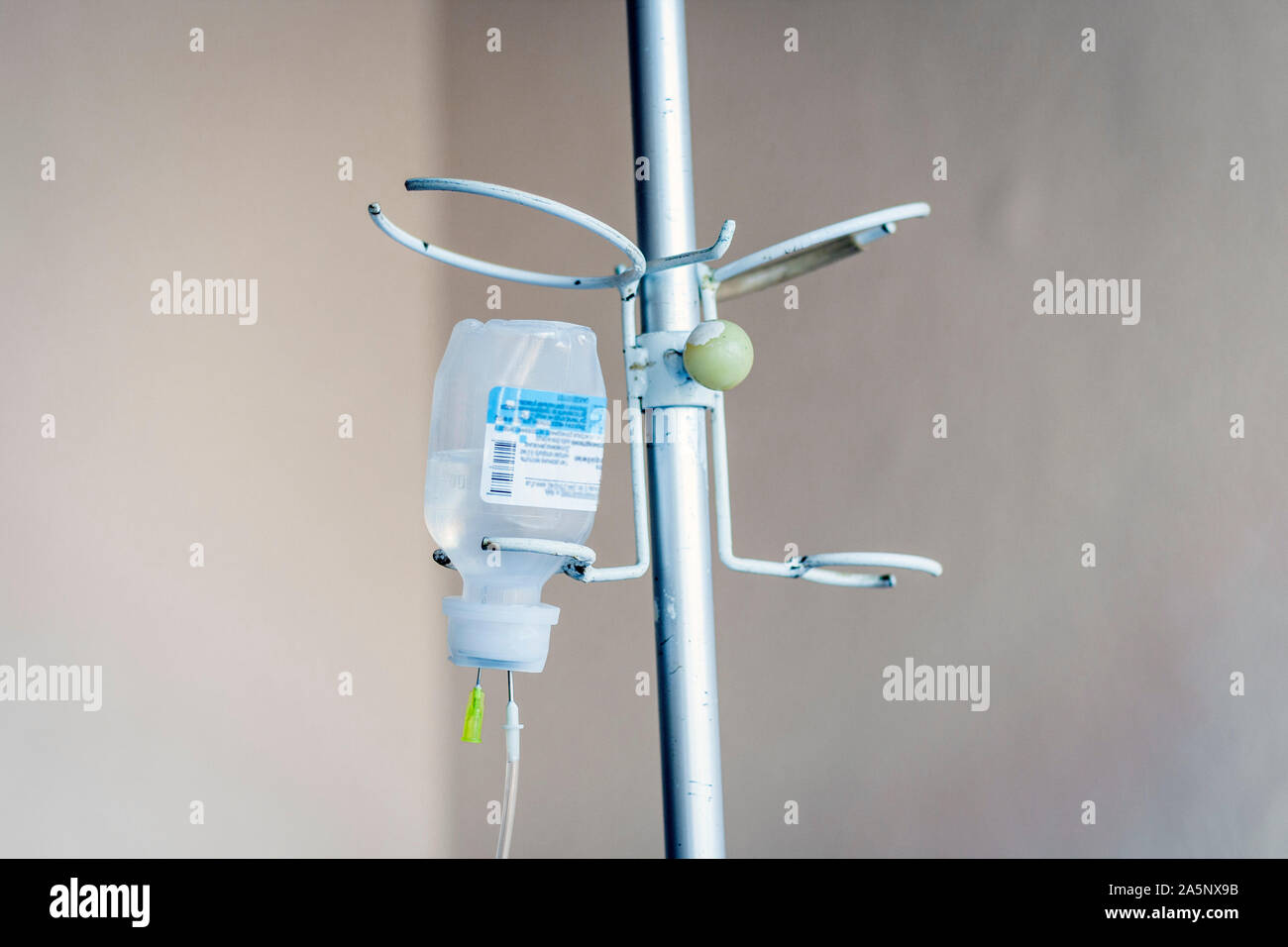 Close-up bottle of medicine on dropper system in the operating room ...