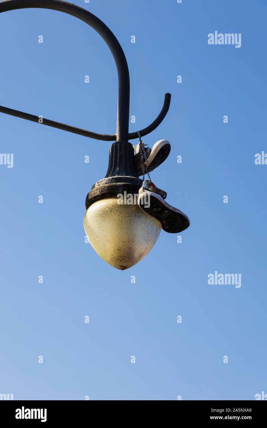 Pier lighting with pair of boots hanging from it. Santa Monica pier ...