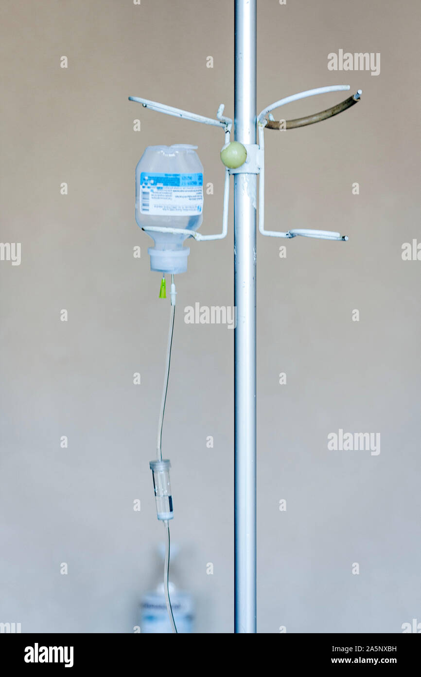 Close-up bottle of medicine on dropper system in the operating room ...