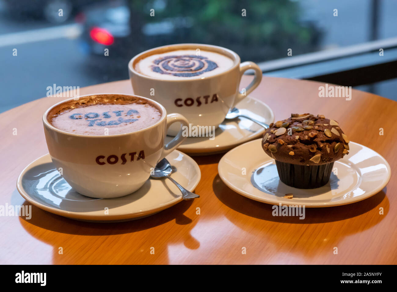 Costa coffee cup muffin hi-res stock photography and images - Alamy