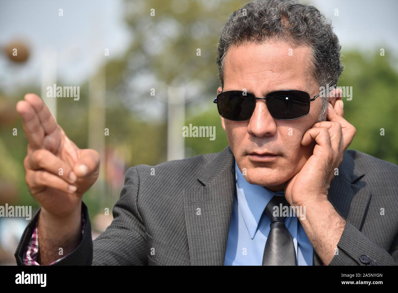 Handsome Security Guard Pointing Wearing Business Suit Stock Photo - Alamy