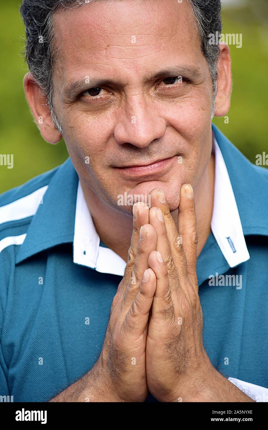 Praying Latino Male Stock Photo - Alamy