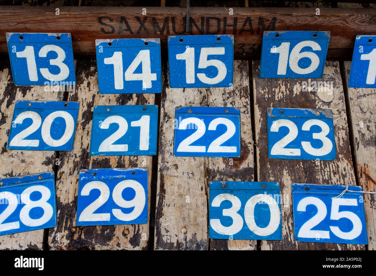 Attractive blue and white scoreboard number plates Stock Photo - Alamy