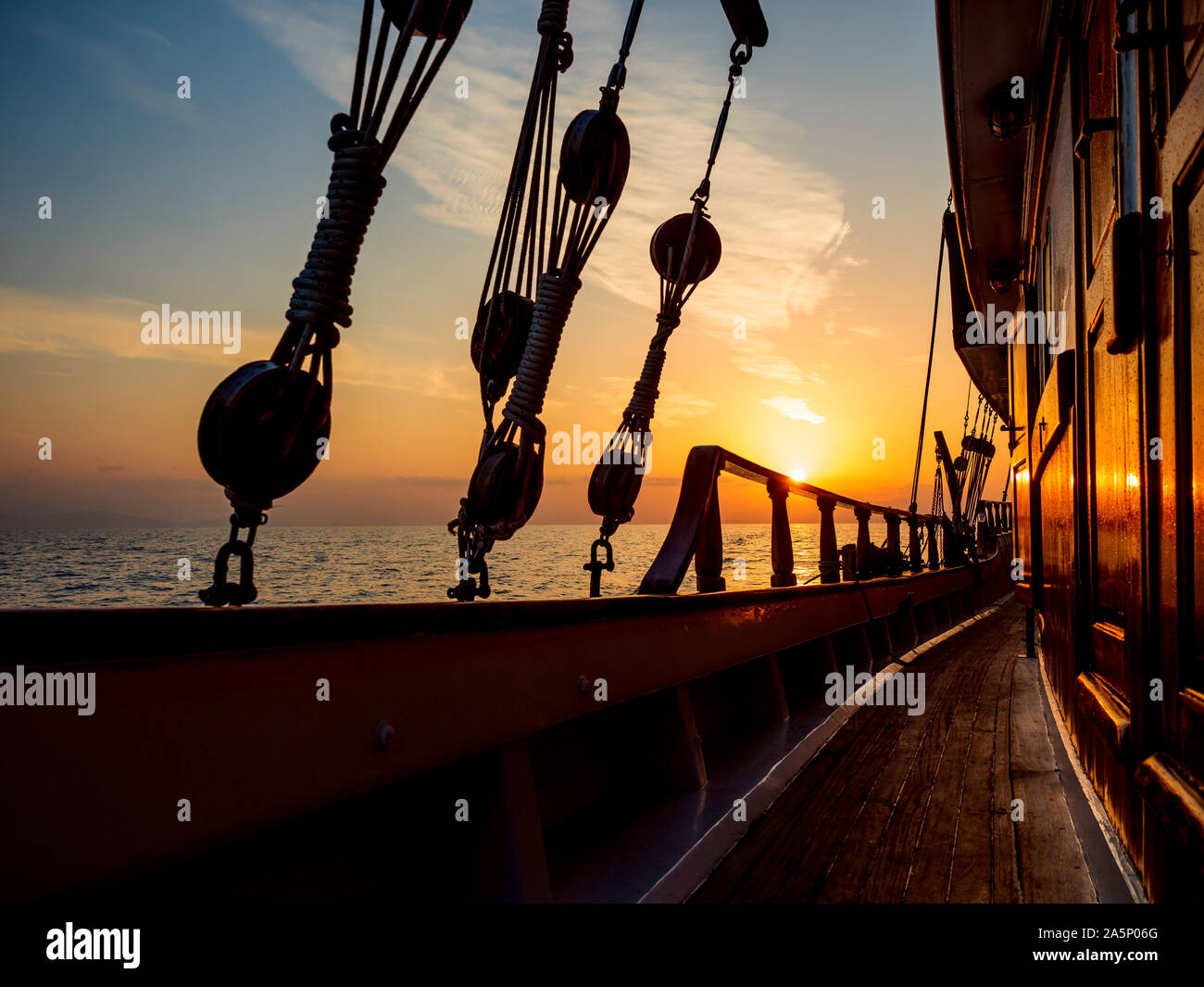 Sunset at the Sailboat deck while cruising in the Cyclades in Greece ...