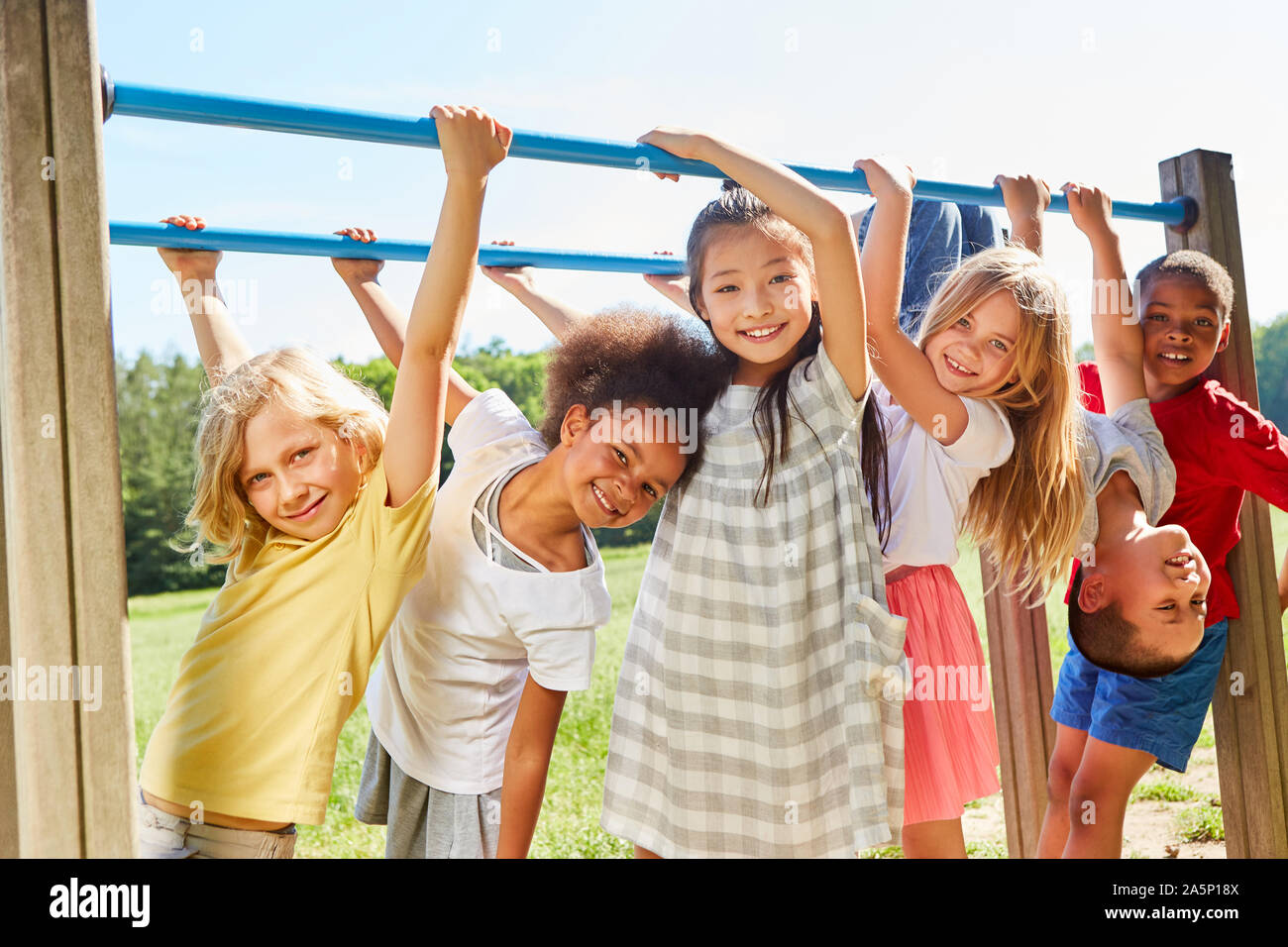 Group of multicultural kids on a sports equipment or playground Stock ...